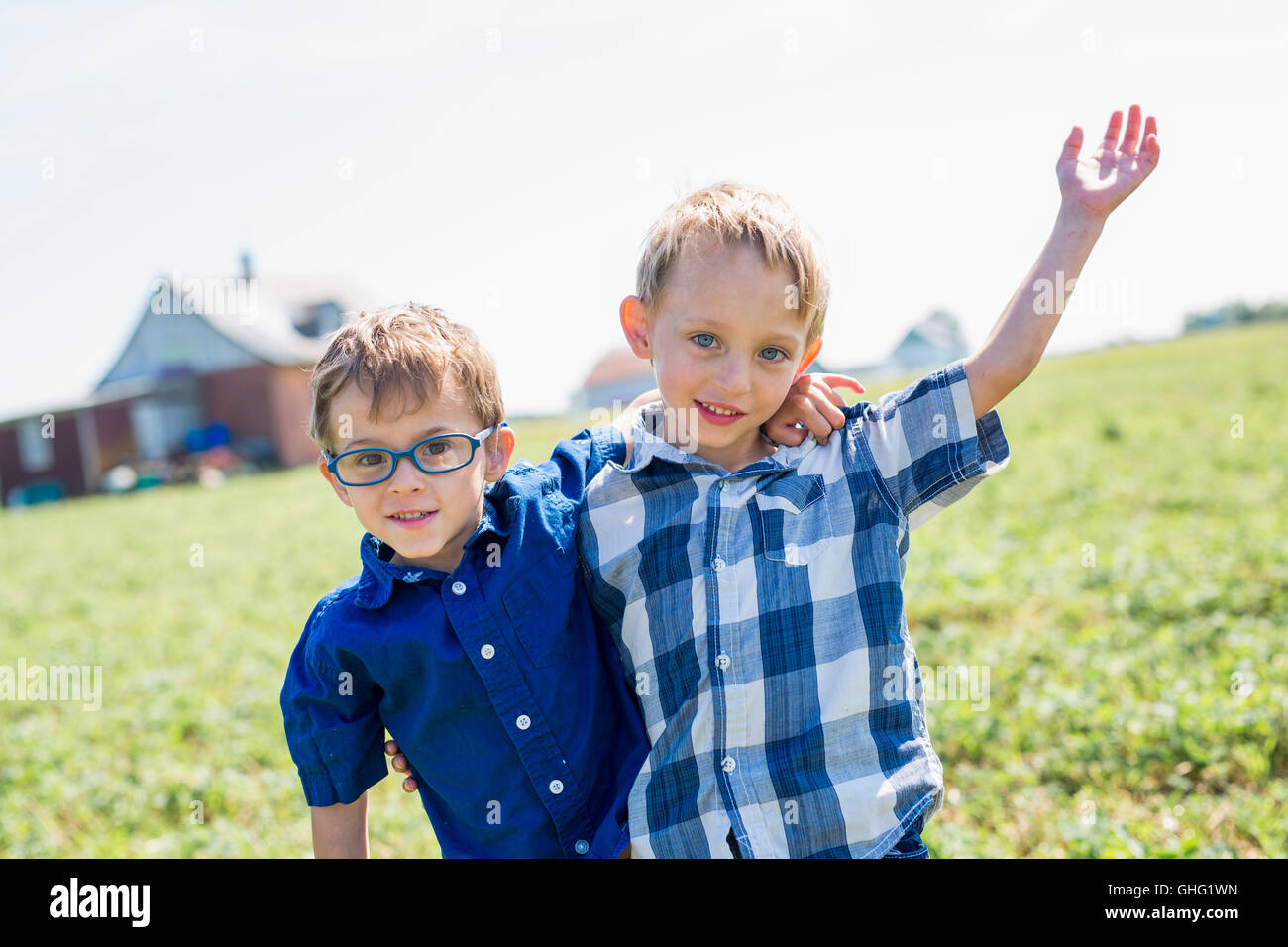 Two Children Together In field Stock Photo - Alamy