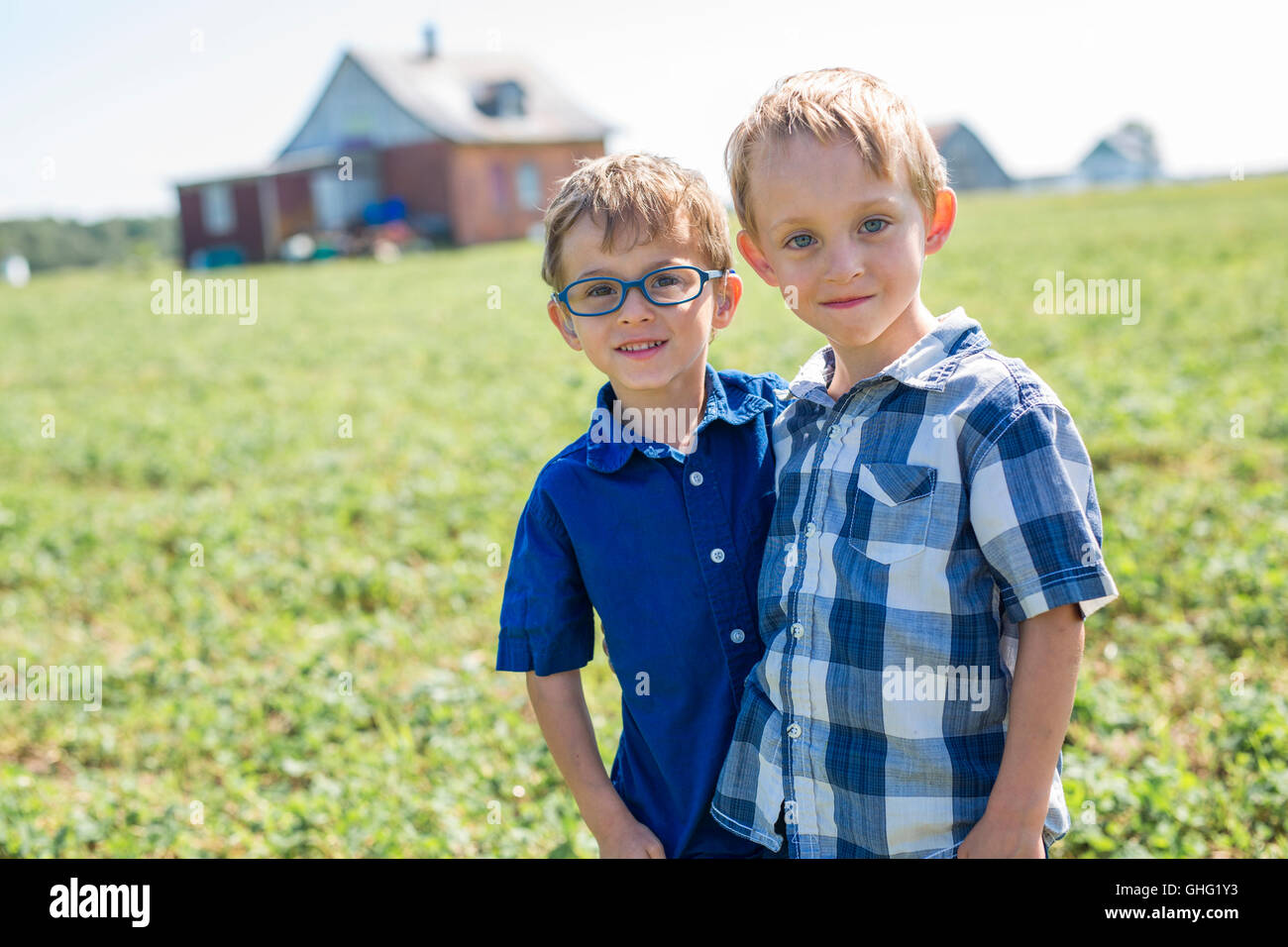 Two Children Together In field Stock Photo - Alamy
