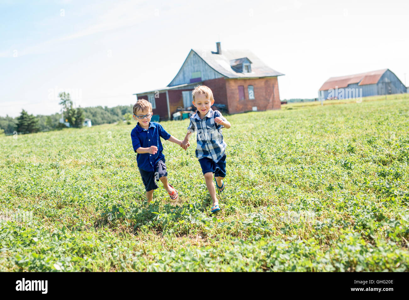 Two Children Together In field Stock Photo - Alamy
