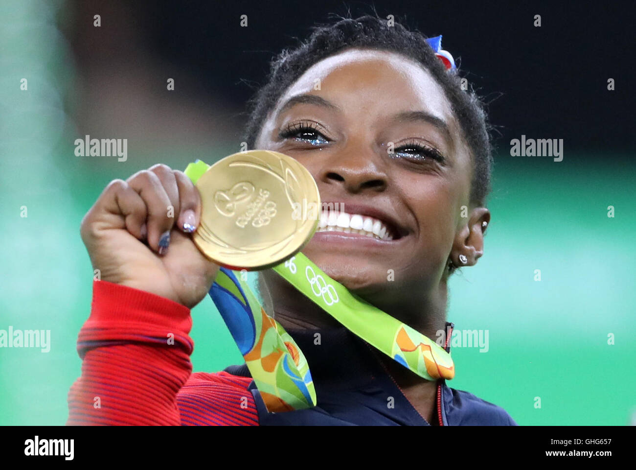 The USA's Simone Biles celebrates victory in the Women's Team ...