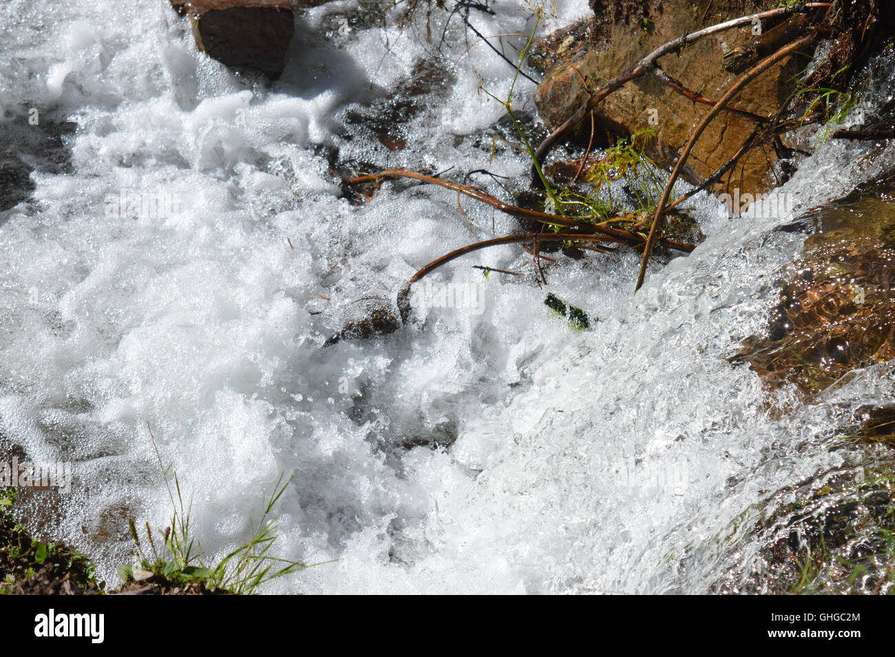 Foam on a water stream Stock Photo - Alamy