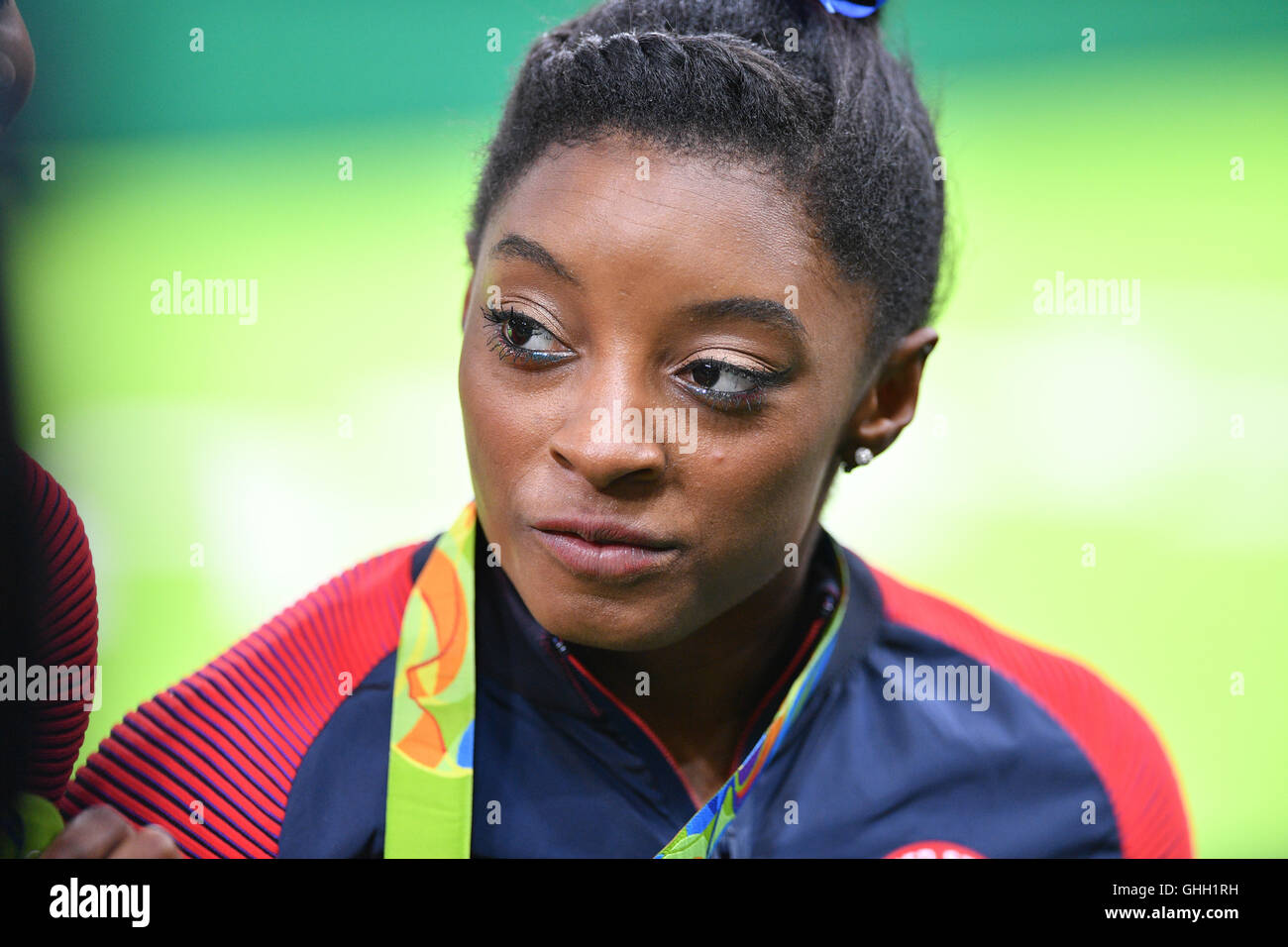 Gold medalist Simone Biles of the USA takes part in the medal ceremony ...