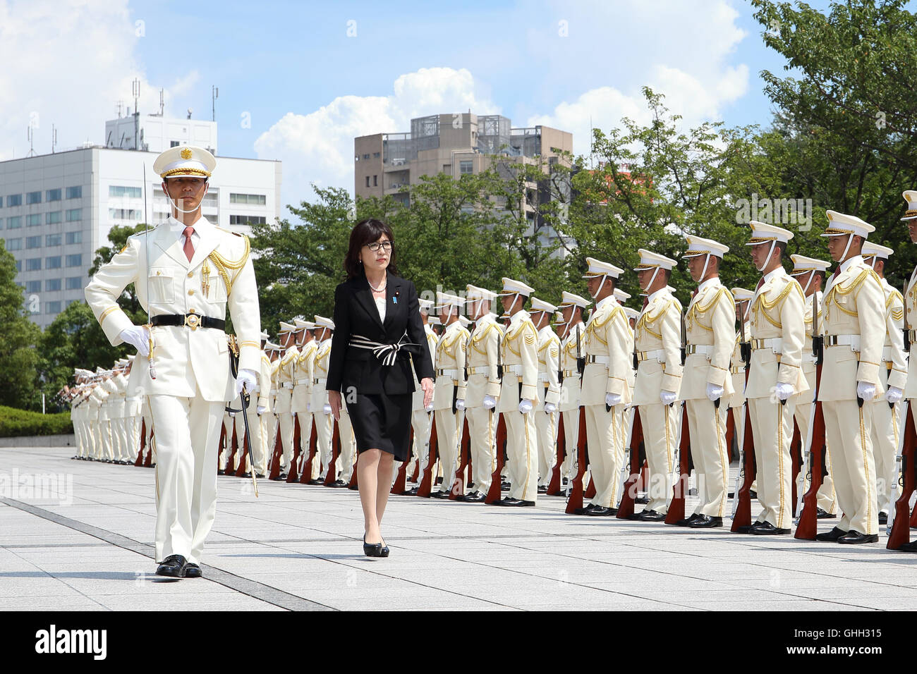 Newly appointed defense minister of Japan, Tomomi Inada reviews a guard ...