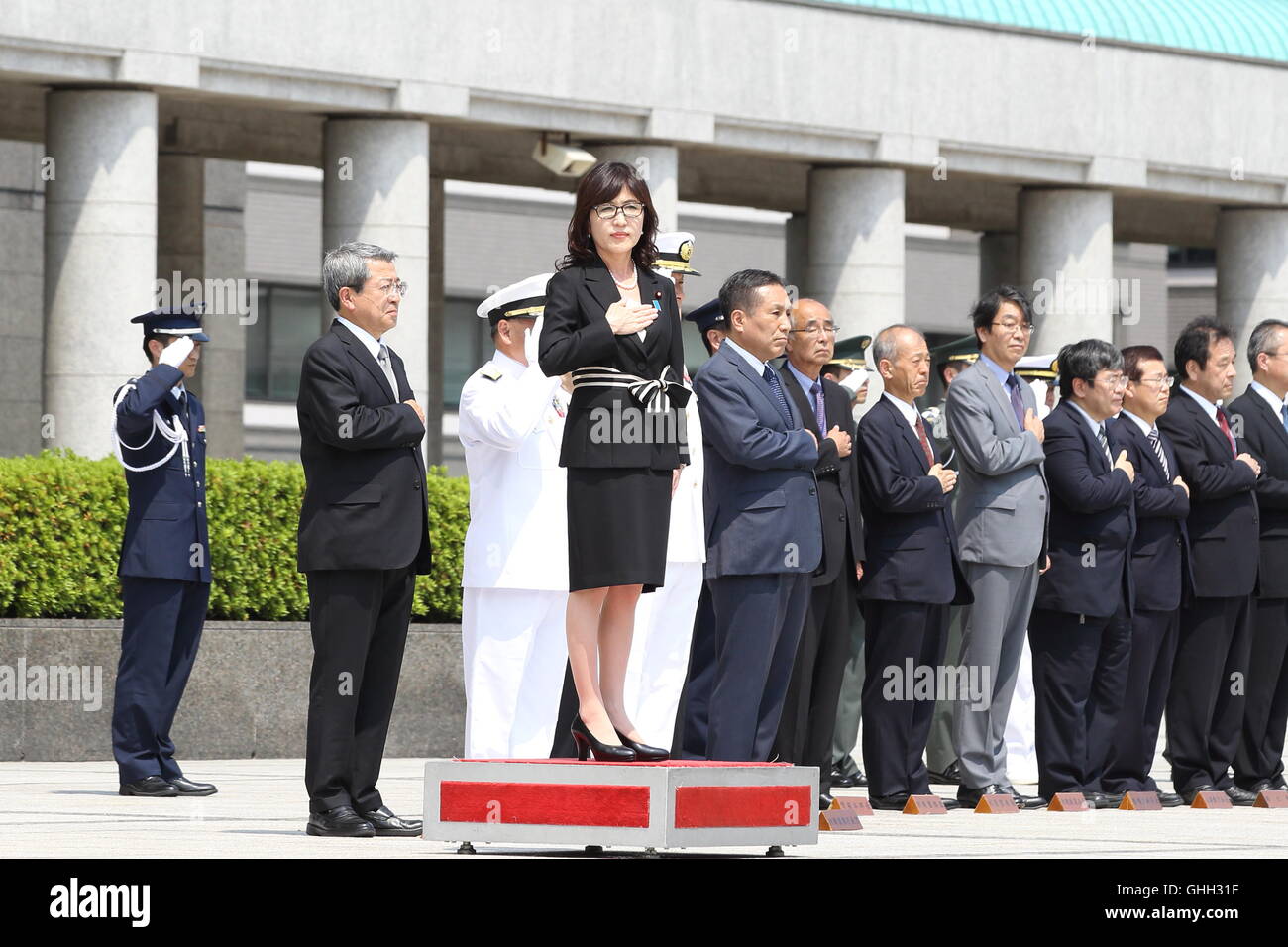 Newly appointed defense minister of Japan, Tomomi Inada reviews a guard ...