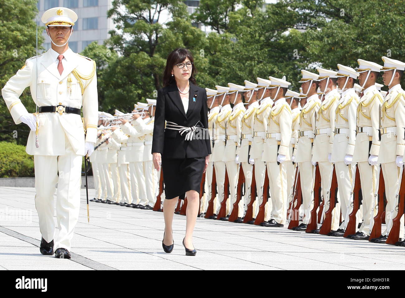 Newly appointed defense minister of Japan, Tomomi Inada reviews a guard ...