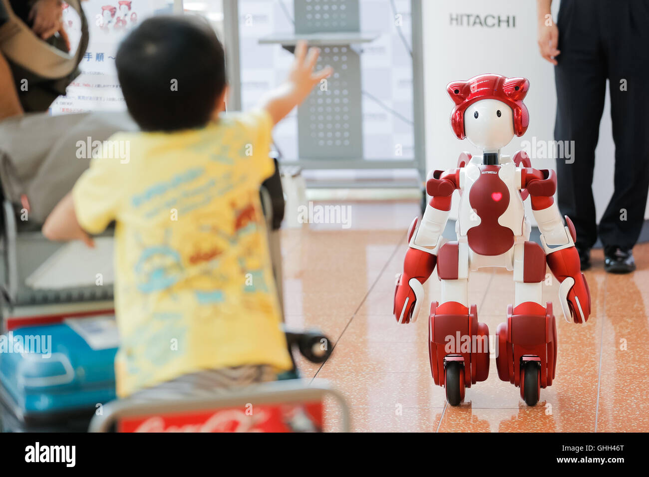 Tokyo, Japan. 14th September, 2016. A boy greets a Hitachi's humanoid ...
