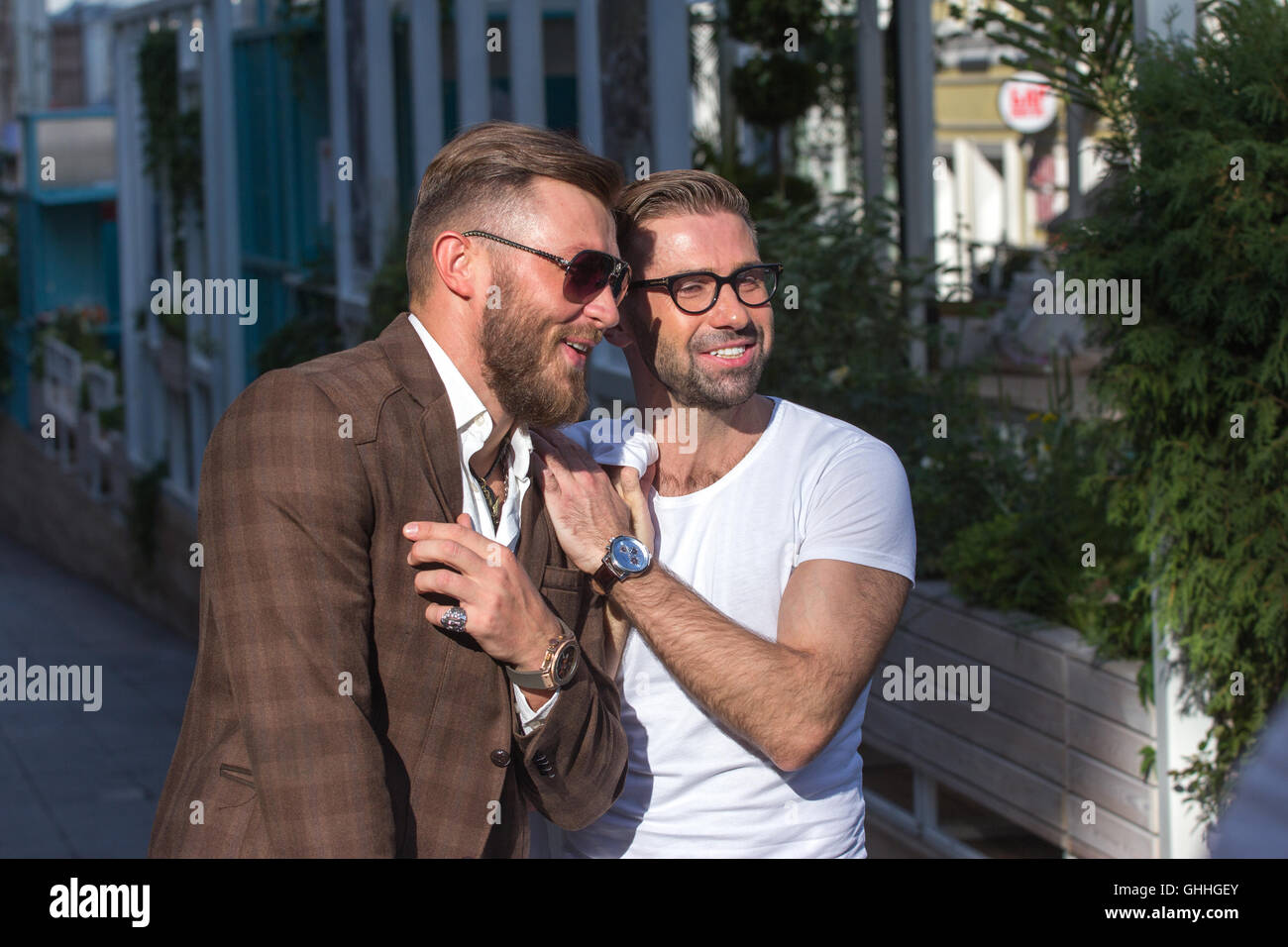 Two friends meeting outdoors. Urban style Stock Photo - Alamy