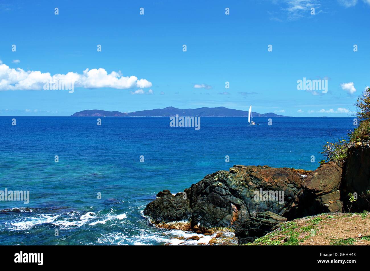 A sail boat on the crystal blue waters of the Caribbean Stock Photo - Alamy