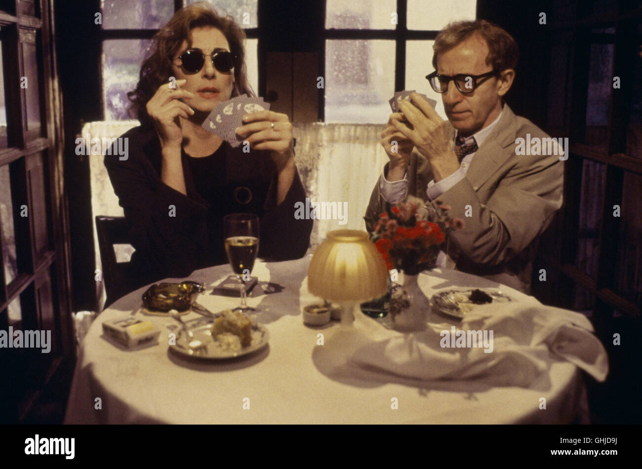 ANJELICA HUSTON (Marcia Fox) and WOODY ALLEN (Larry Lipton) with cards ...
