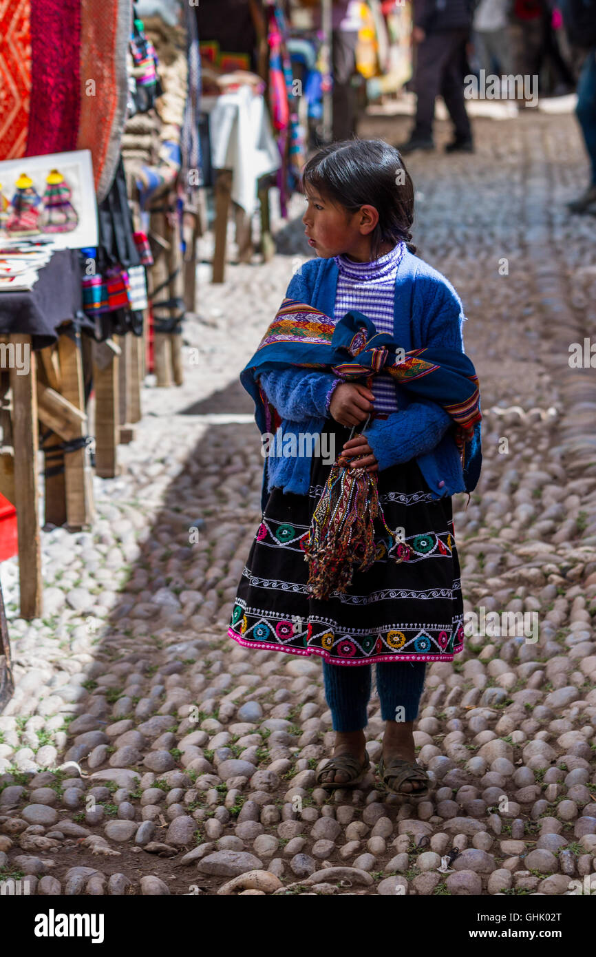 Pisac, Peru - May 15: Adorable native Quechua girl walking the ...