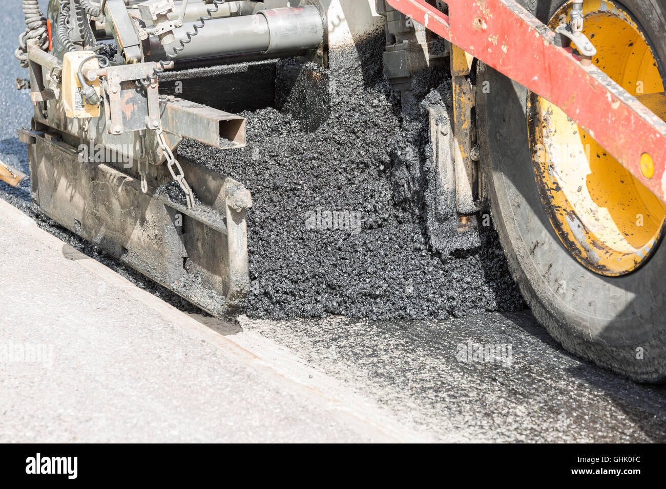 Asphalt Paver Laying Down Asphalt close up Stock Photo - Alamy