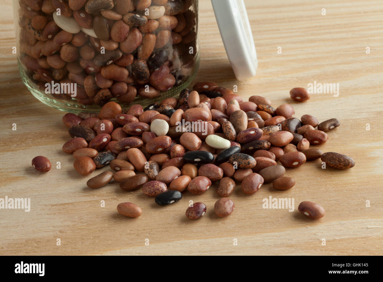 Glass jar with pebble beans close up Stock Photo - Alamy
