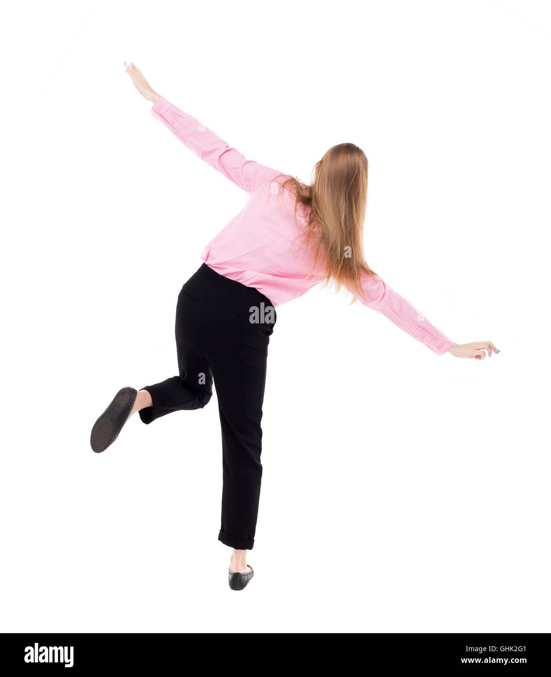 Balancing young business woman Stock Photo - Alamy