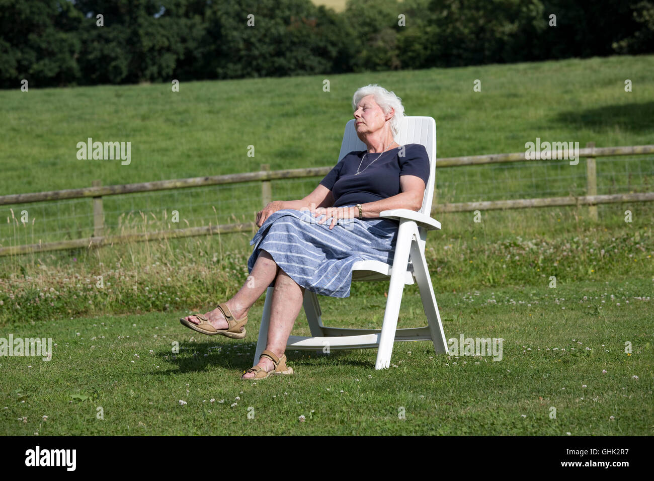 Woman asleep chair hi-res stock photography and images - Alamy