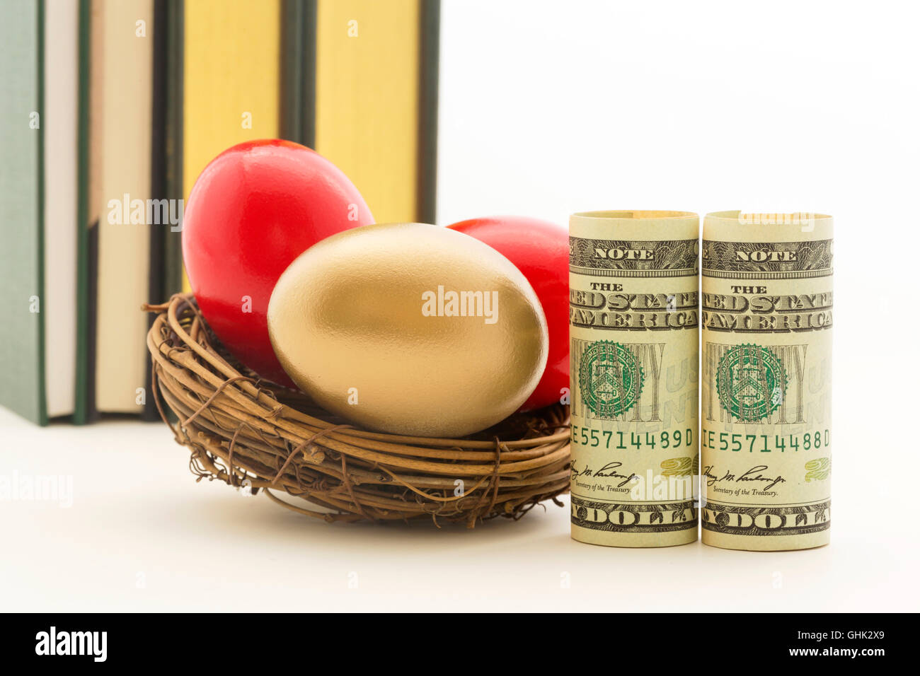 Pair of red nest eggs and two, symbolic American dollars reflect risks ...