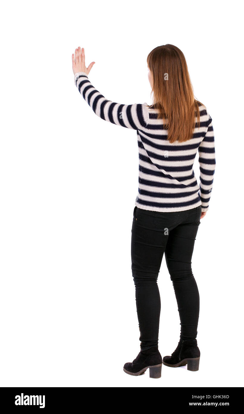 back view of young woman presses down on something Stock Photo - Alamy