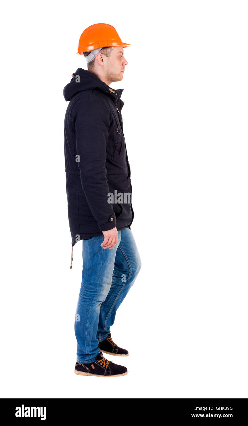 Back view of walking engineer in helmet Stock Photo - Alamy
