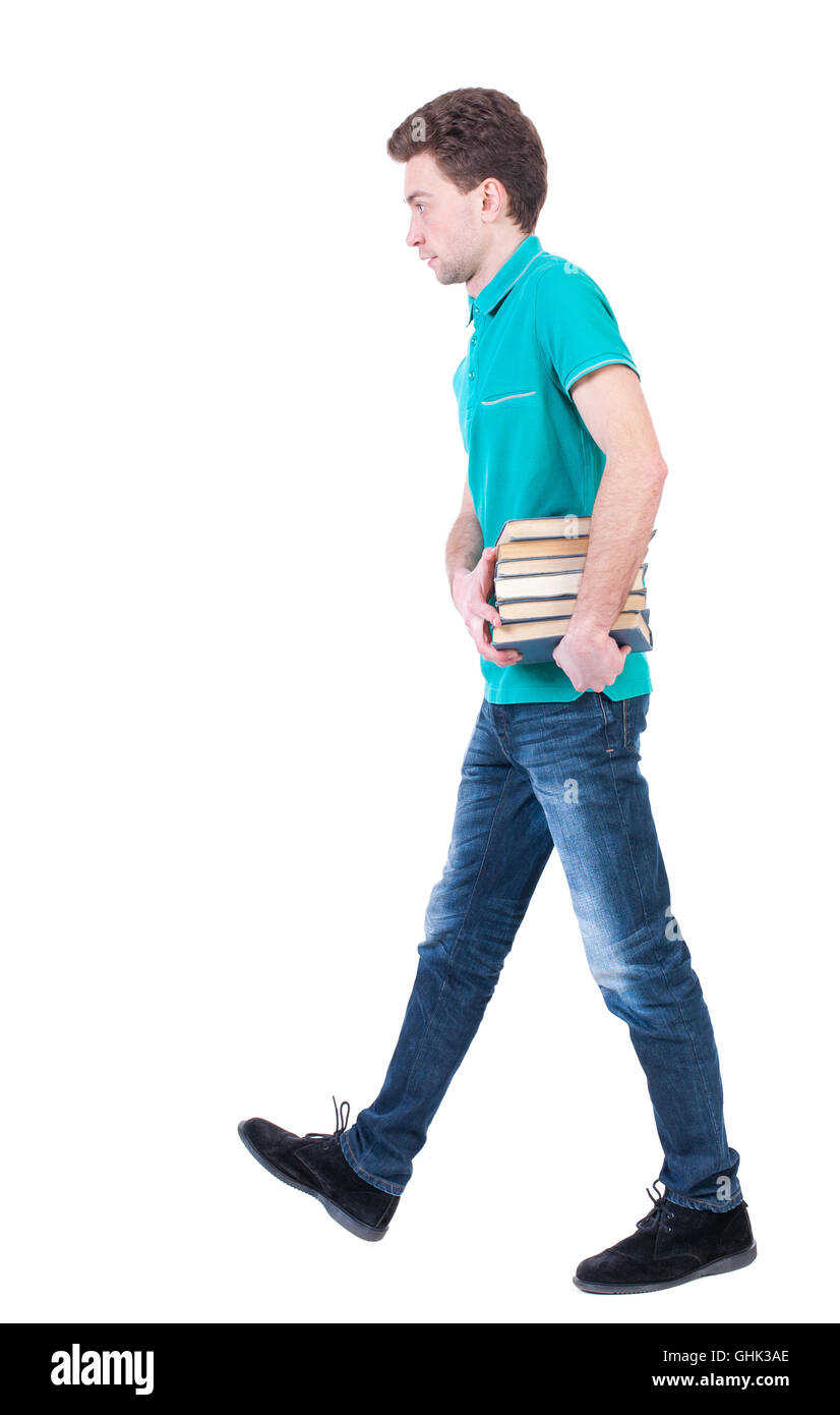 side view going man carries a stack of books Stock Photo - Alamy