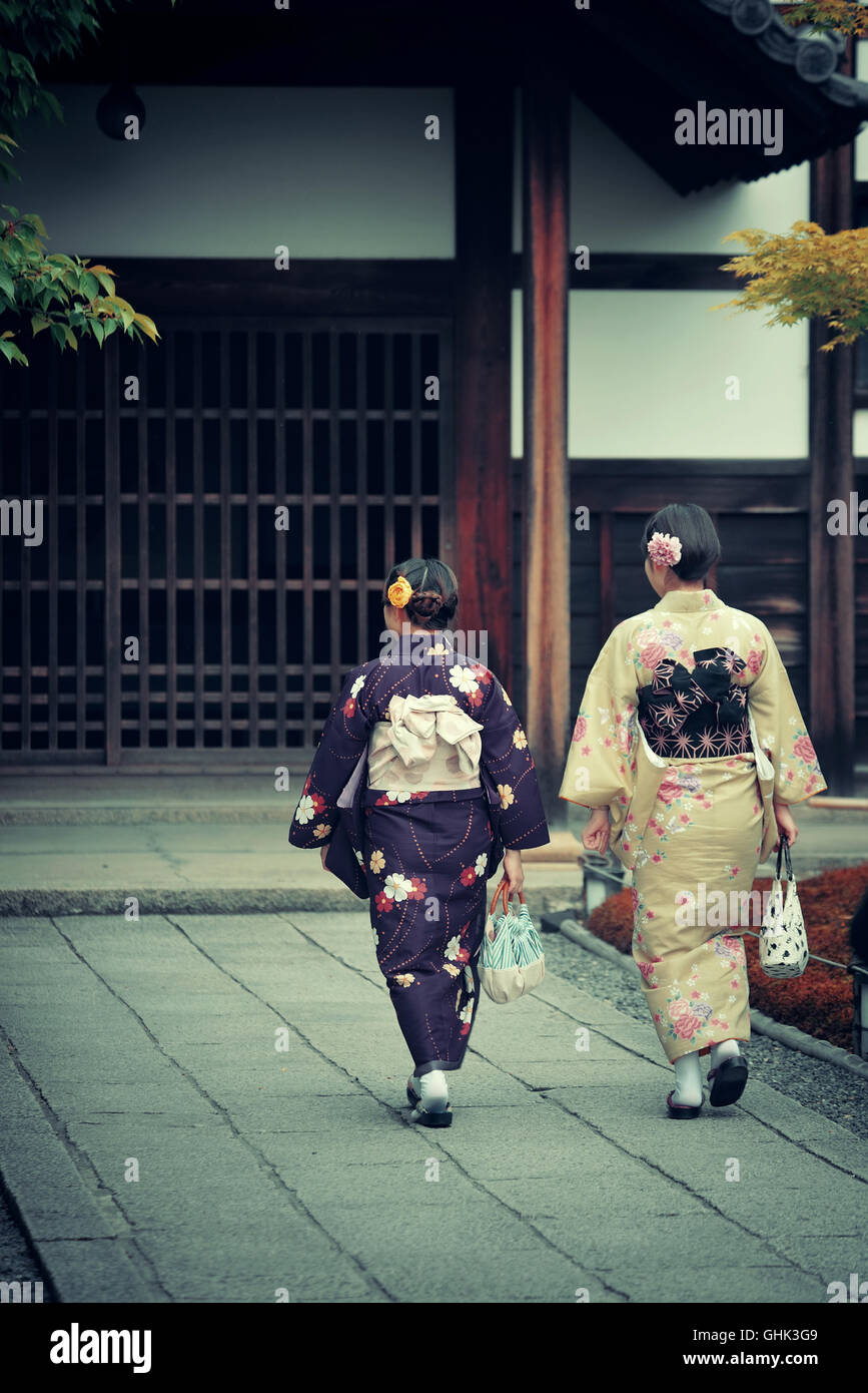 Japanese woman in traditional costume in shrine with historical ...