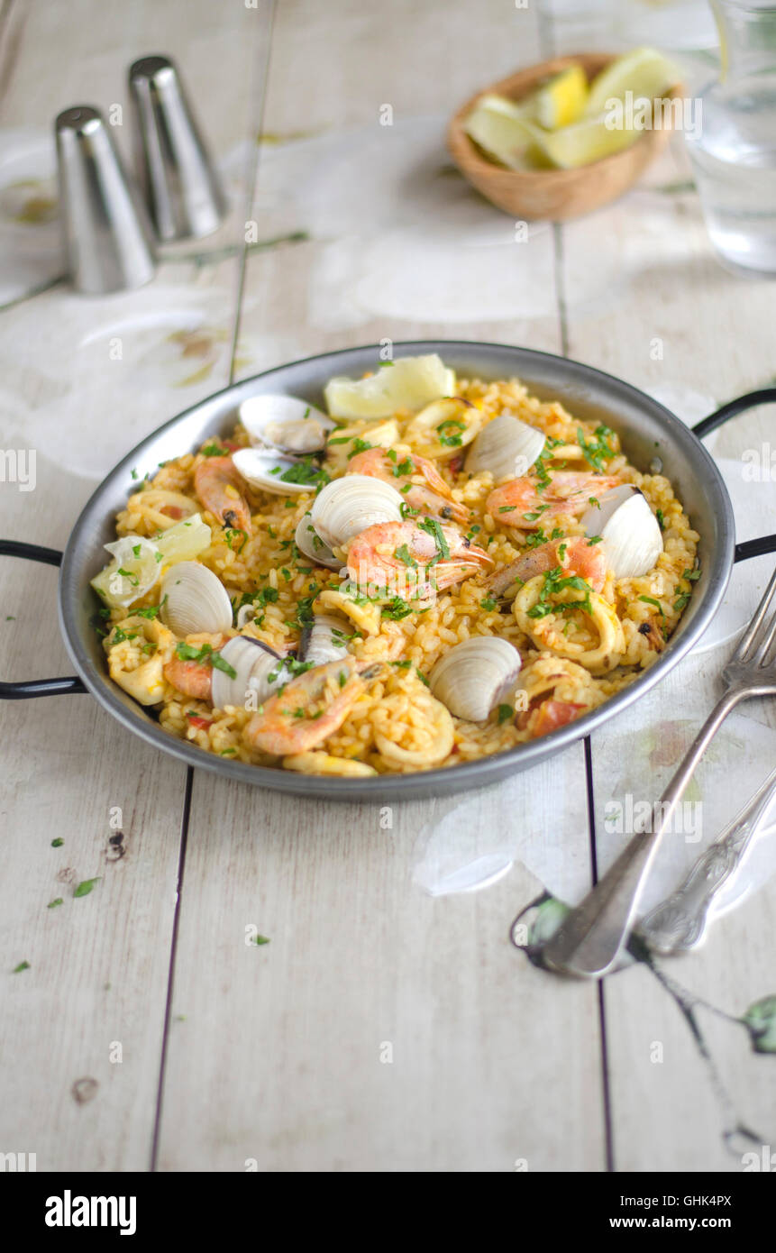 Spanish paella with prawns, squid and clams Stock Photo - Alamy