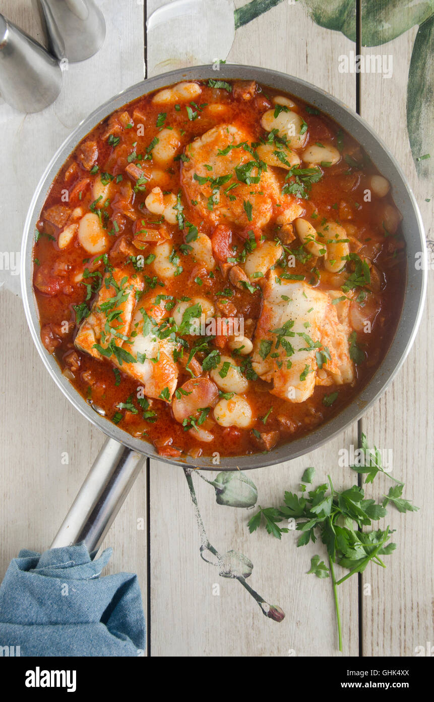 Cod, chorizo and butter bean stew in a pan Stock Photo - Alamy
