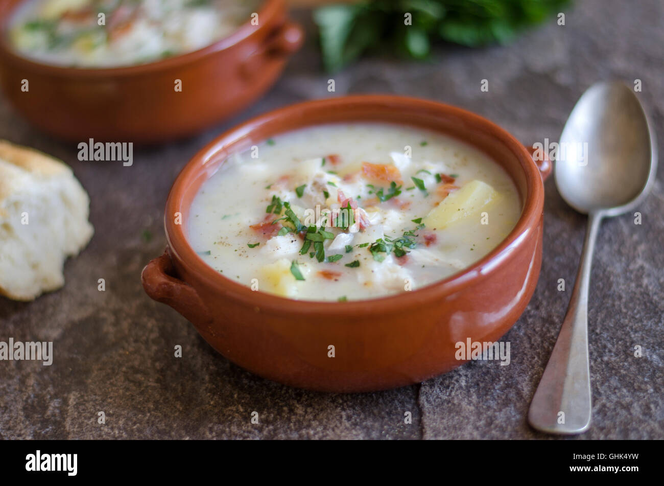 Smoked haddock chowder topped with crispy bacon Stock Photo - Alamy