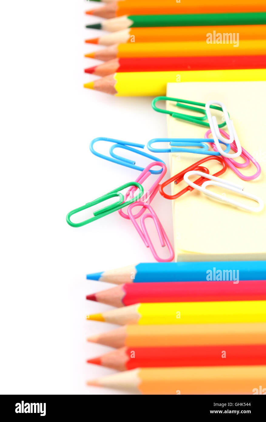 set of colored pencils and paper clips on a white background Stock ...