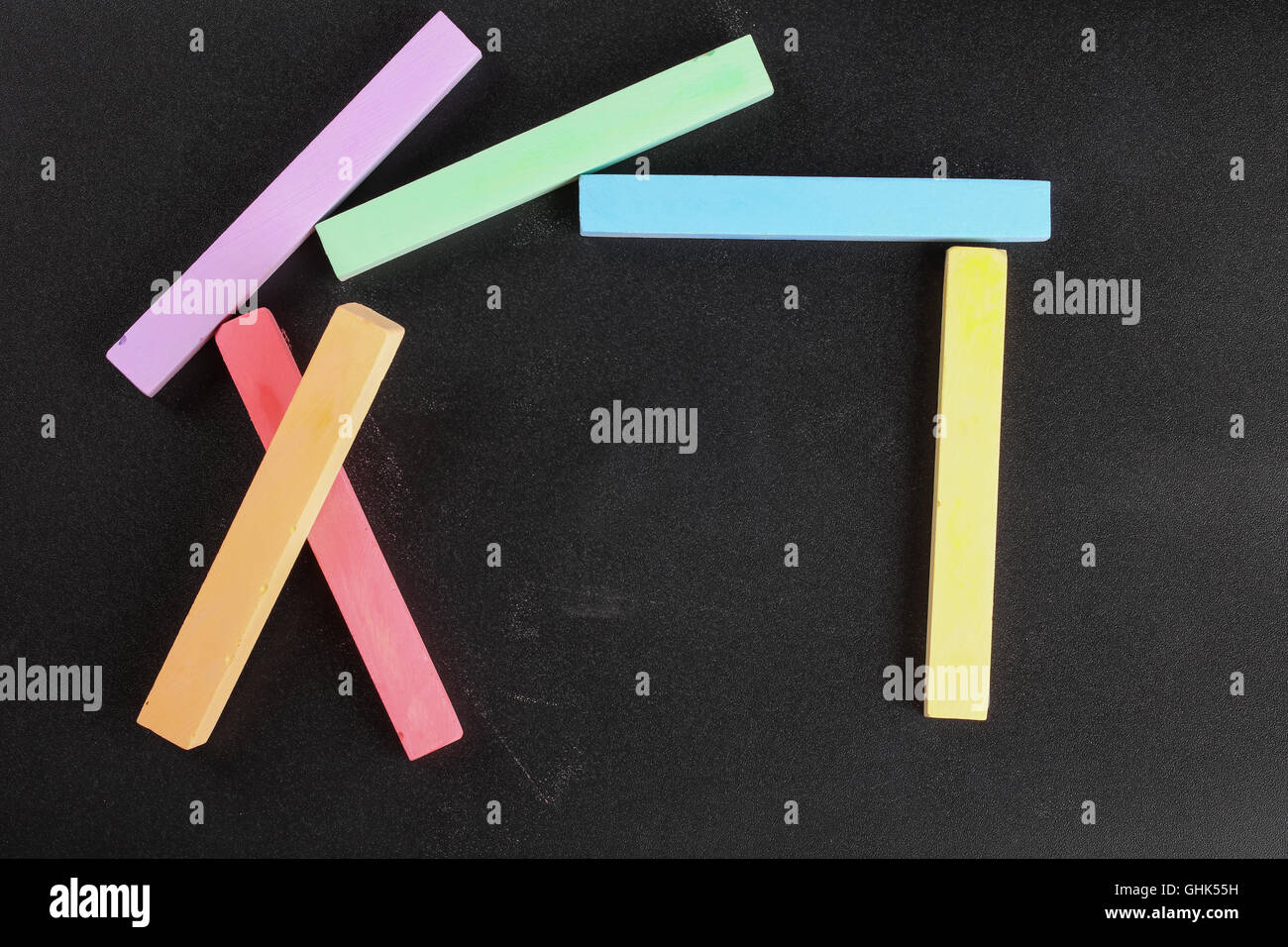 set of colored crayons on a black background Stock Photo - Alamy