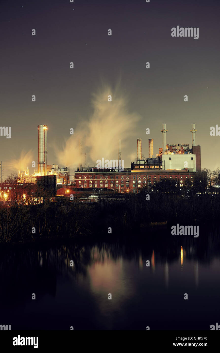 Factory with chimney at night in Philadelphia Stock Photo - Alamy