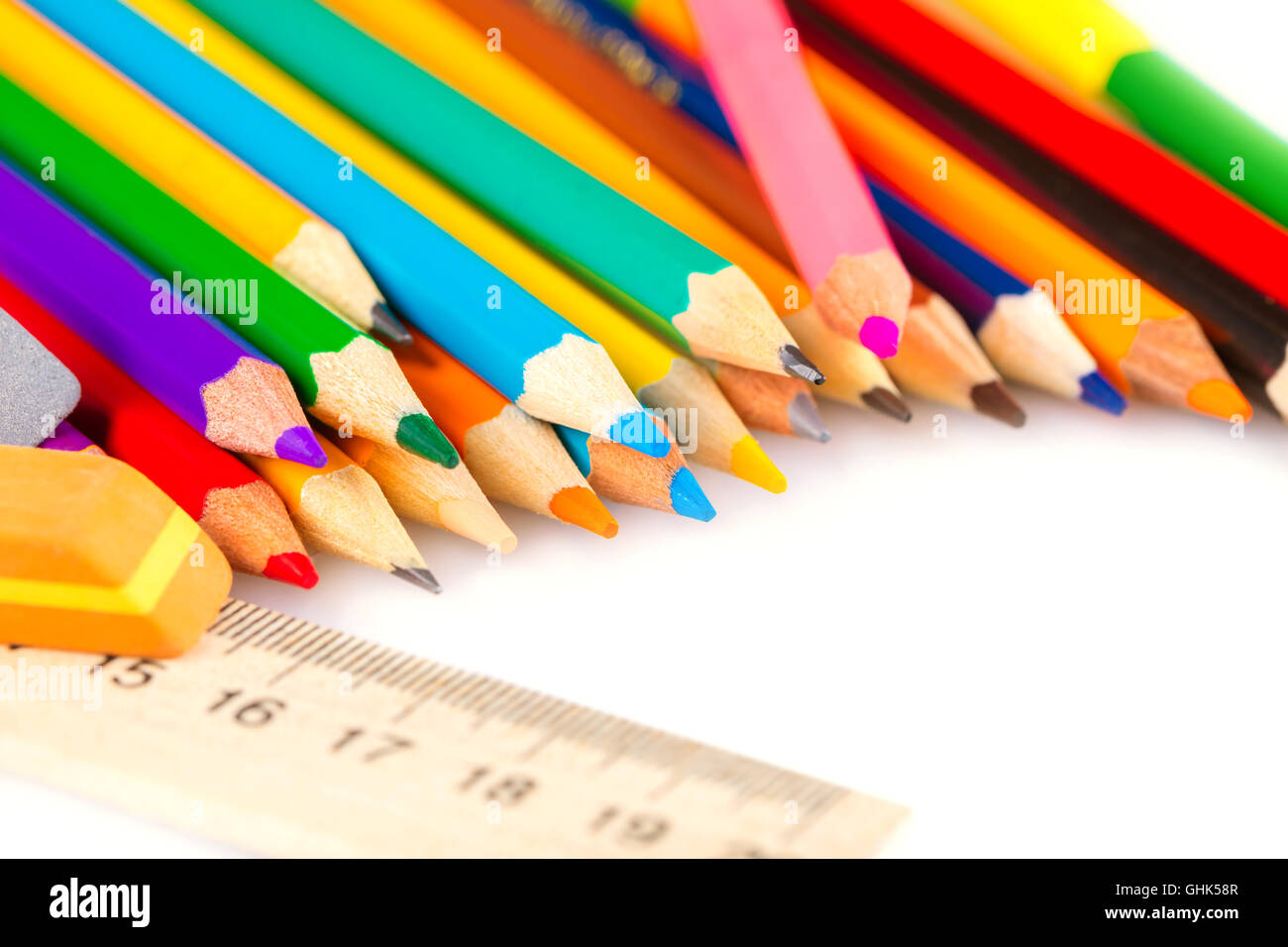 set of colored pencils with a ruler and an eraser Stock Photo - Alamy