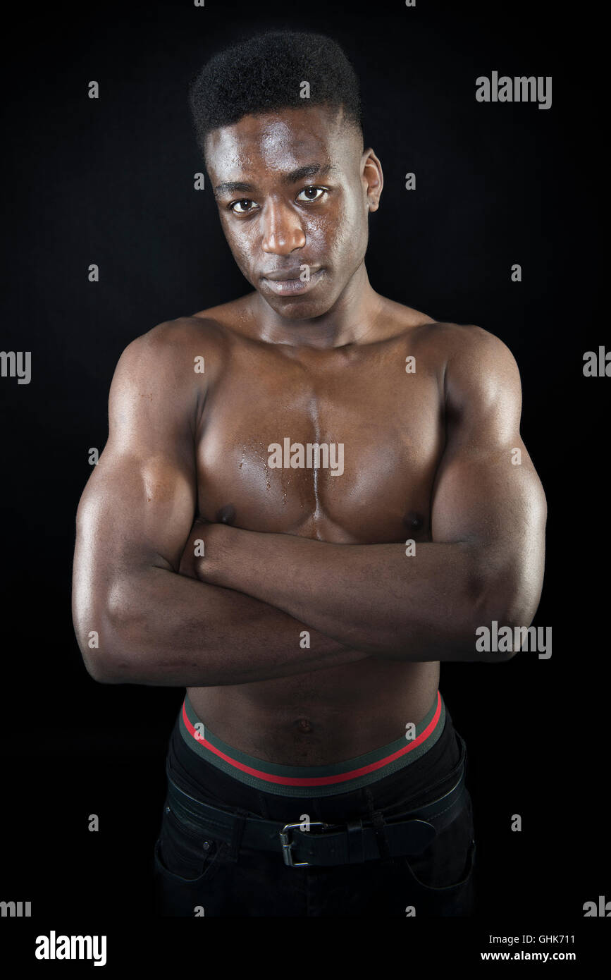 Sportsman athlete model muscular sweating wet face and torso arms ...