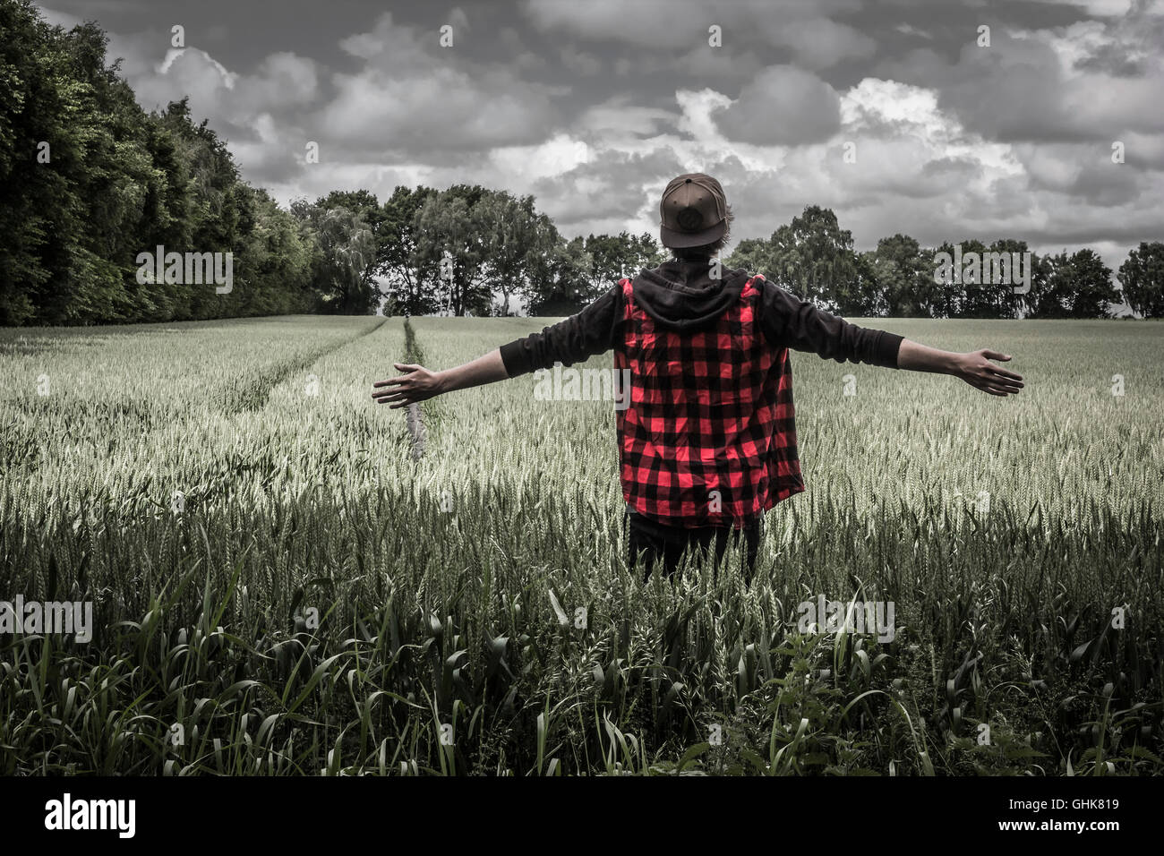 sad boy in rural landscape Stock Photo - Alamy