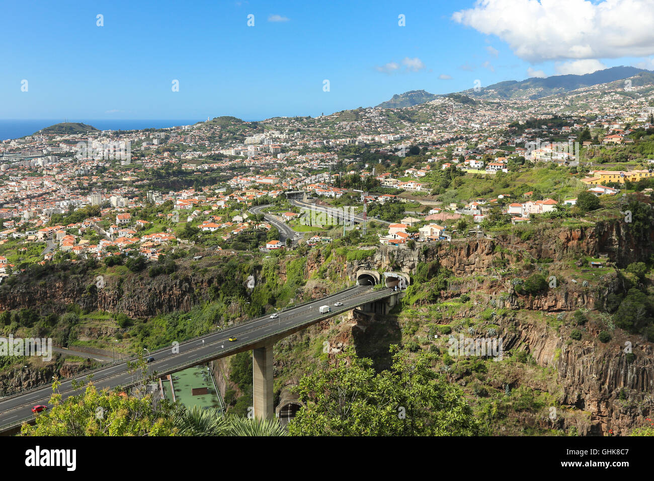 Aerial view of Funchal city with the highway and tunnel at the Via ...