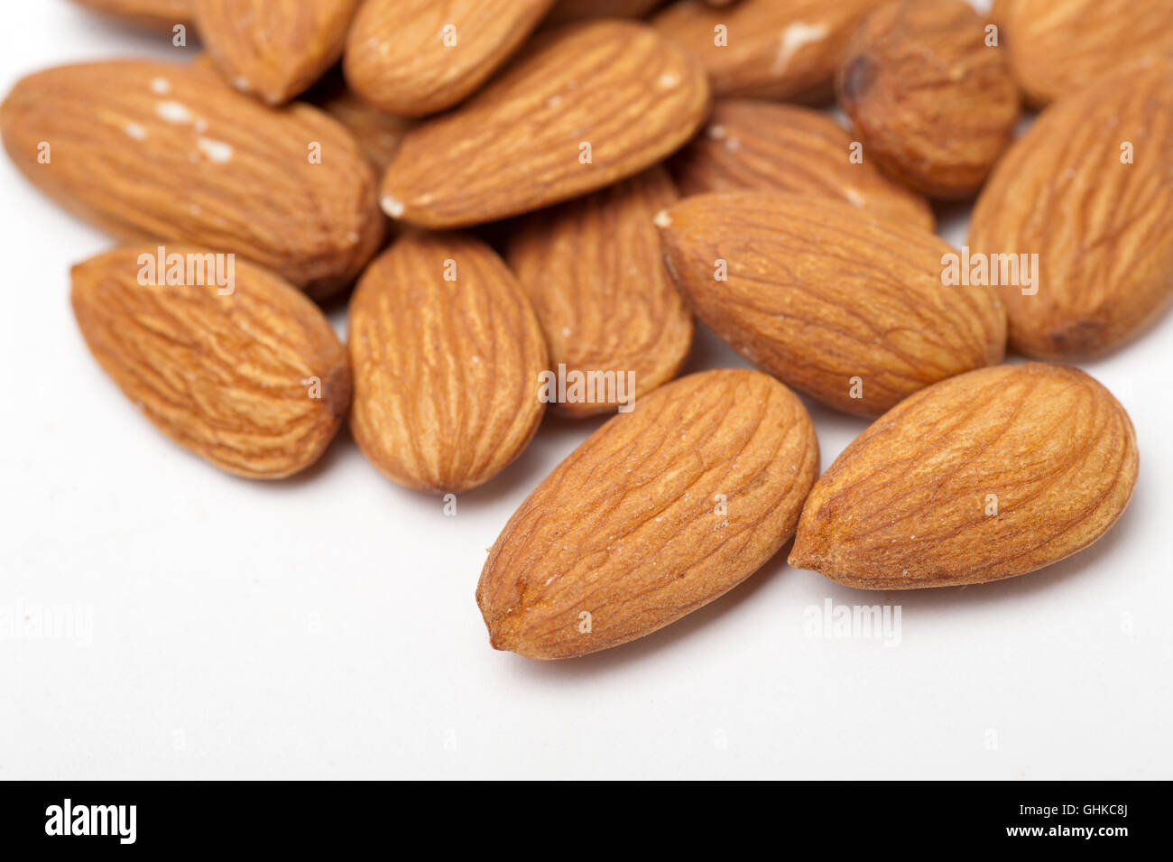 Peeled Almonds in shell On white Background Stock Photo - Alamy