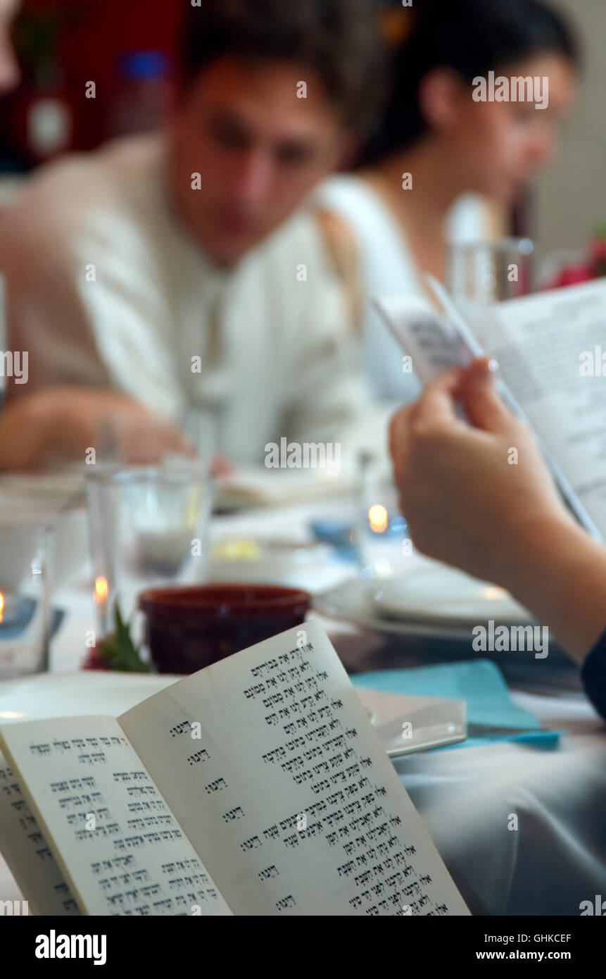 family around the Traditional sedder table set for a Jewish Festive ...