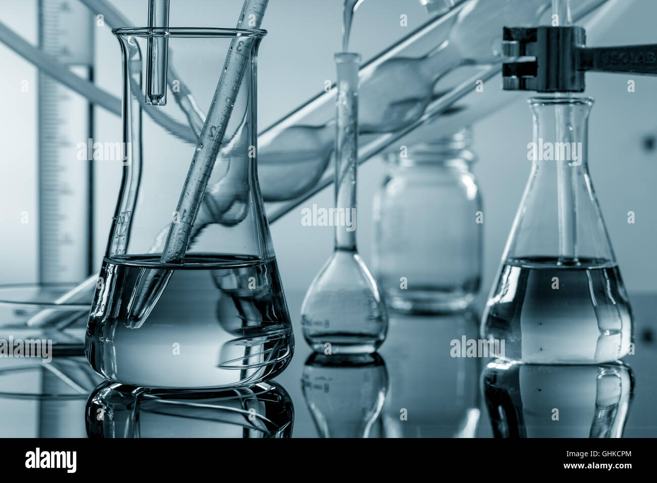 Chemical glass on laboratory table Stock Photo - Alamy