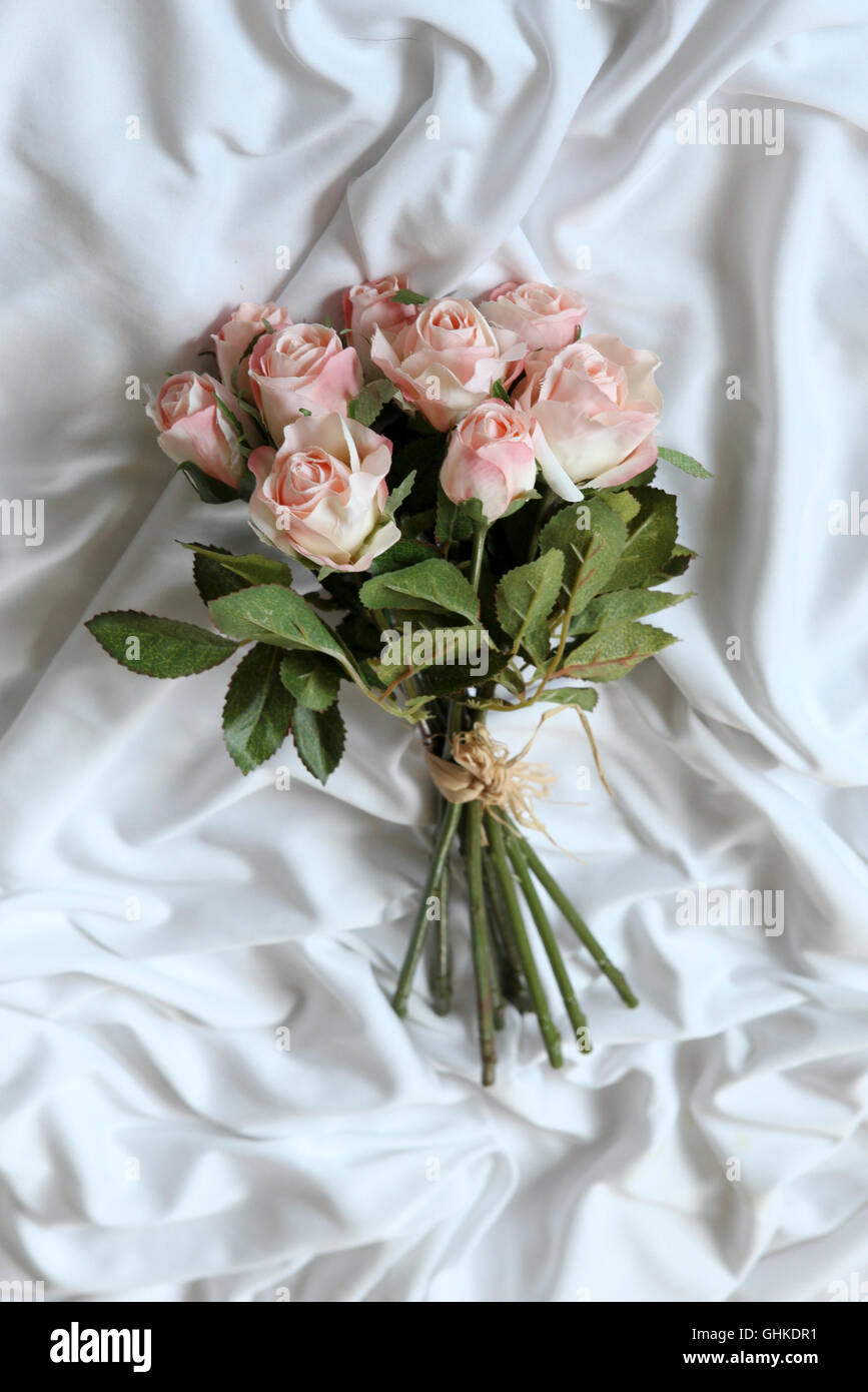 Pink Roses Silk flower on white background Stock Photo - Alamy