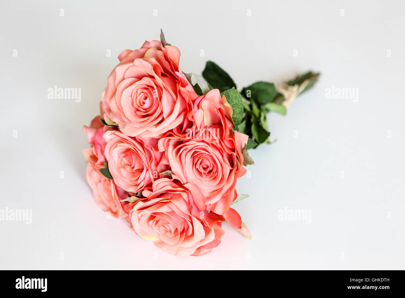 Silk Pink Rose Bouquet on white background Stock Photo - Alamy