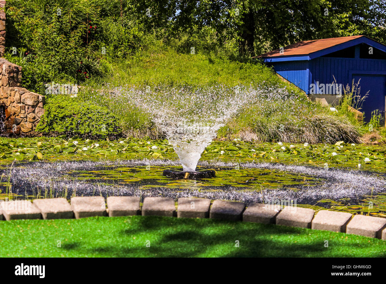 Water fountain circle on mini golf course Stock Photo - Alamy