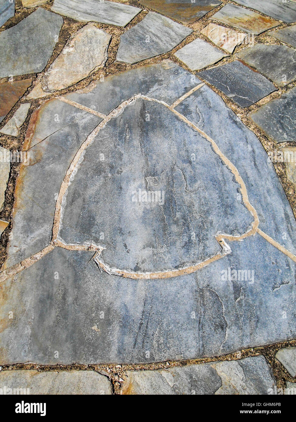 Arrowhead carved in stone Stock Photo - Alamy