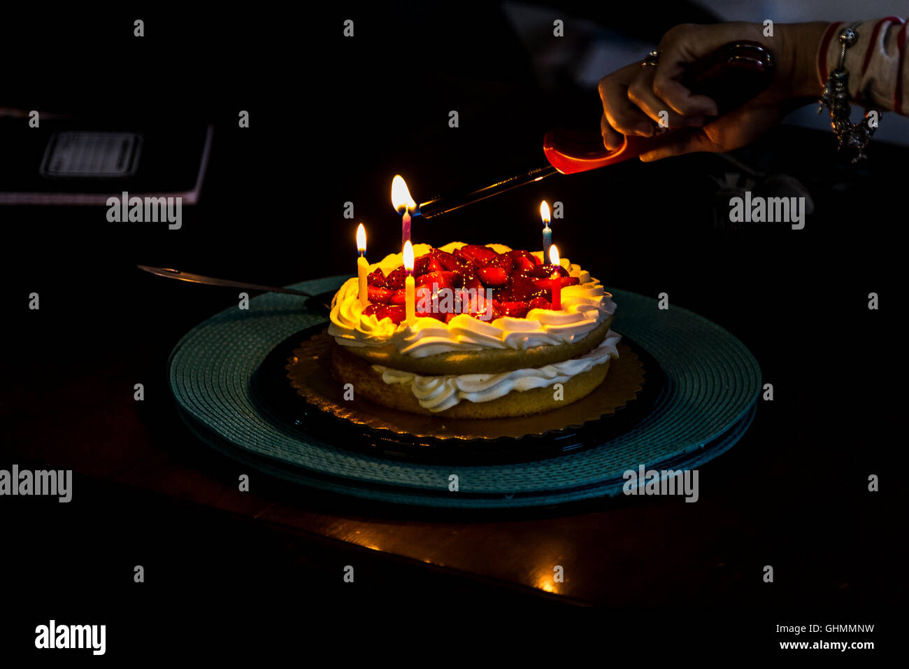 Lighting of the Birthday Candles Stock Photo - Alamy