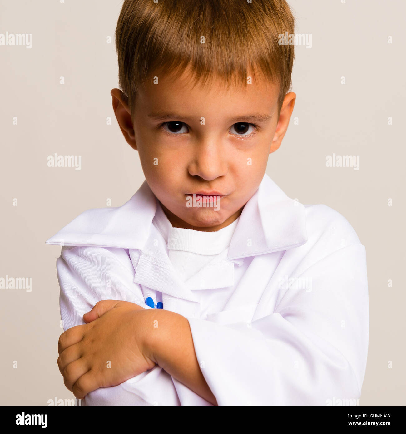 Portrait of serious child in the doctor's suit Stock Photo - Alamy