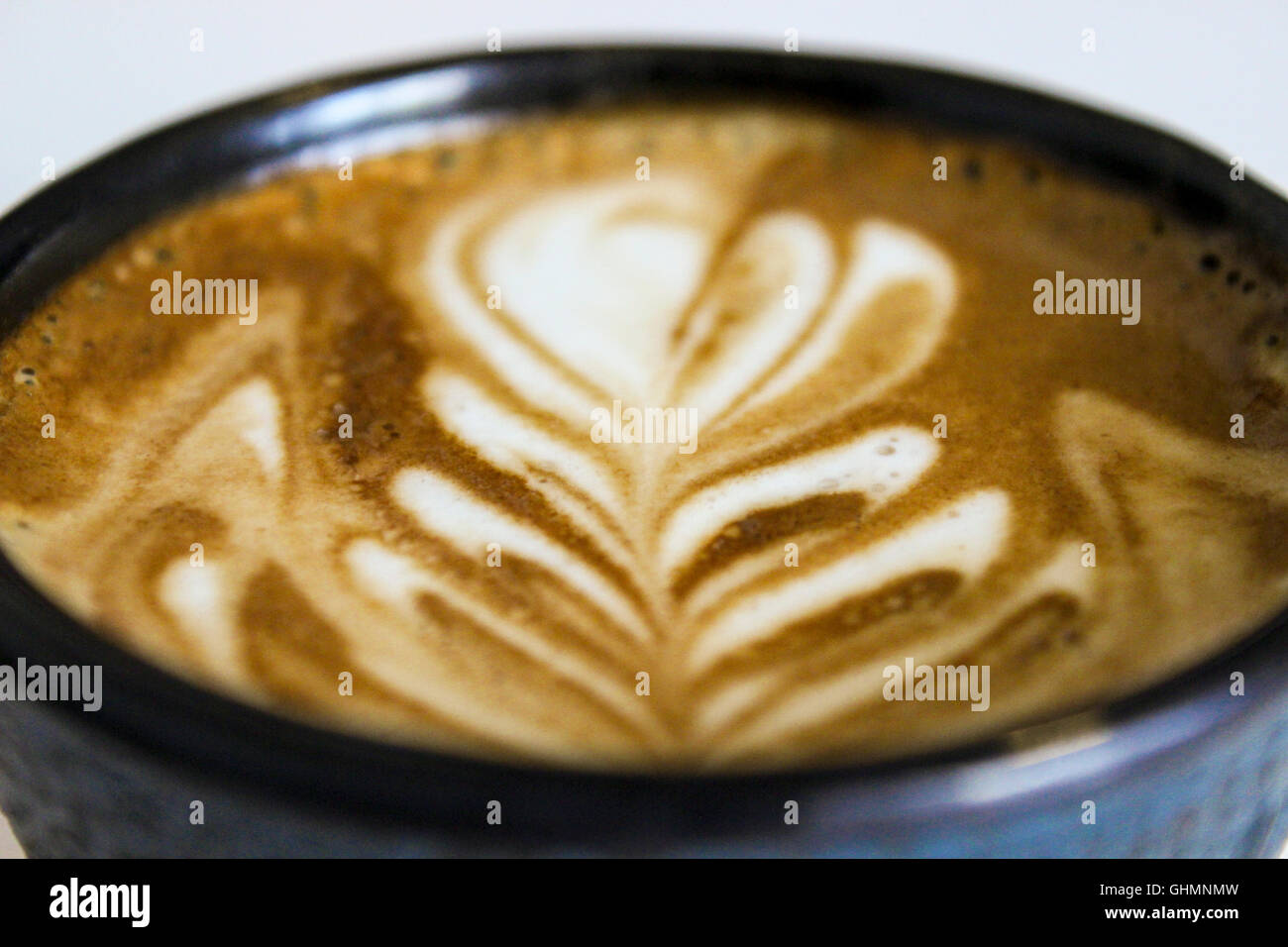 Coffee with artistic flower Stock Photo - Alamy
