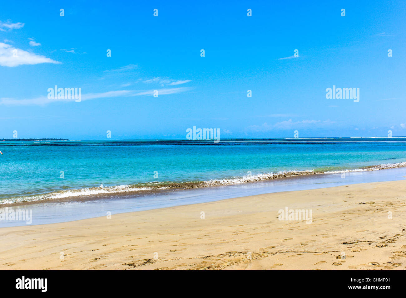 Bright Blue Sky on Sandy Beach and Breaking Sea Wave Stock Photo - Alamy