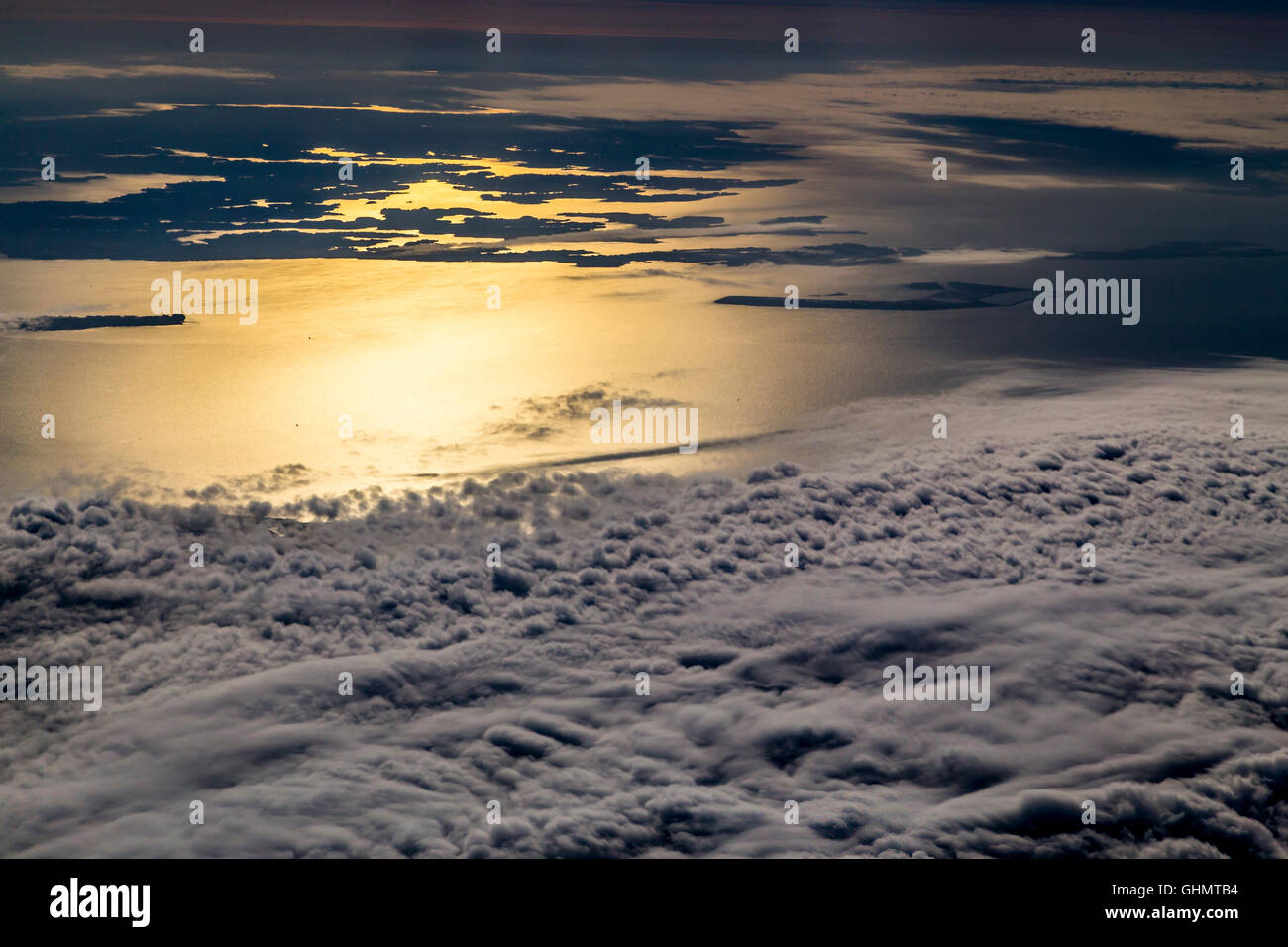 Clouds from Above in the Sky with Sun Reflecting on Sea Stock Photo - Alamy