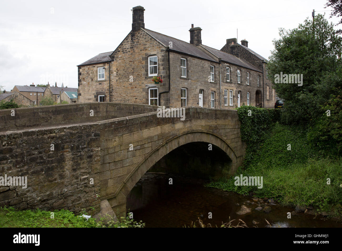 Stone buildings by the road bridge at Bellingham in Northumberland ...