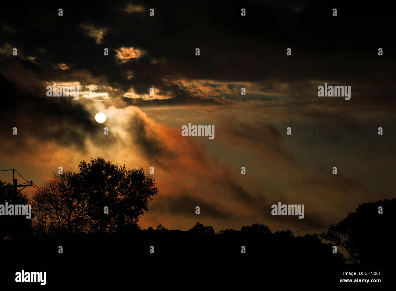 Sun Behind Clouds Stock Photo - Alamy