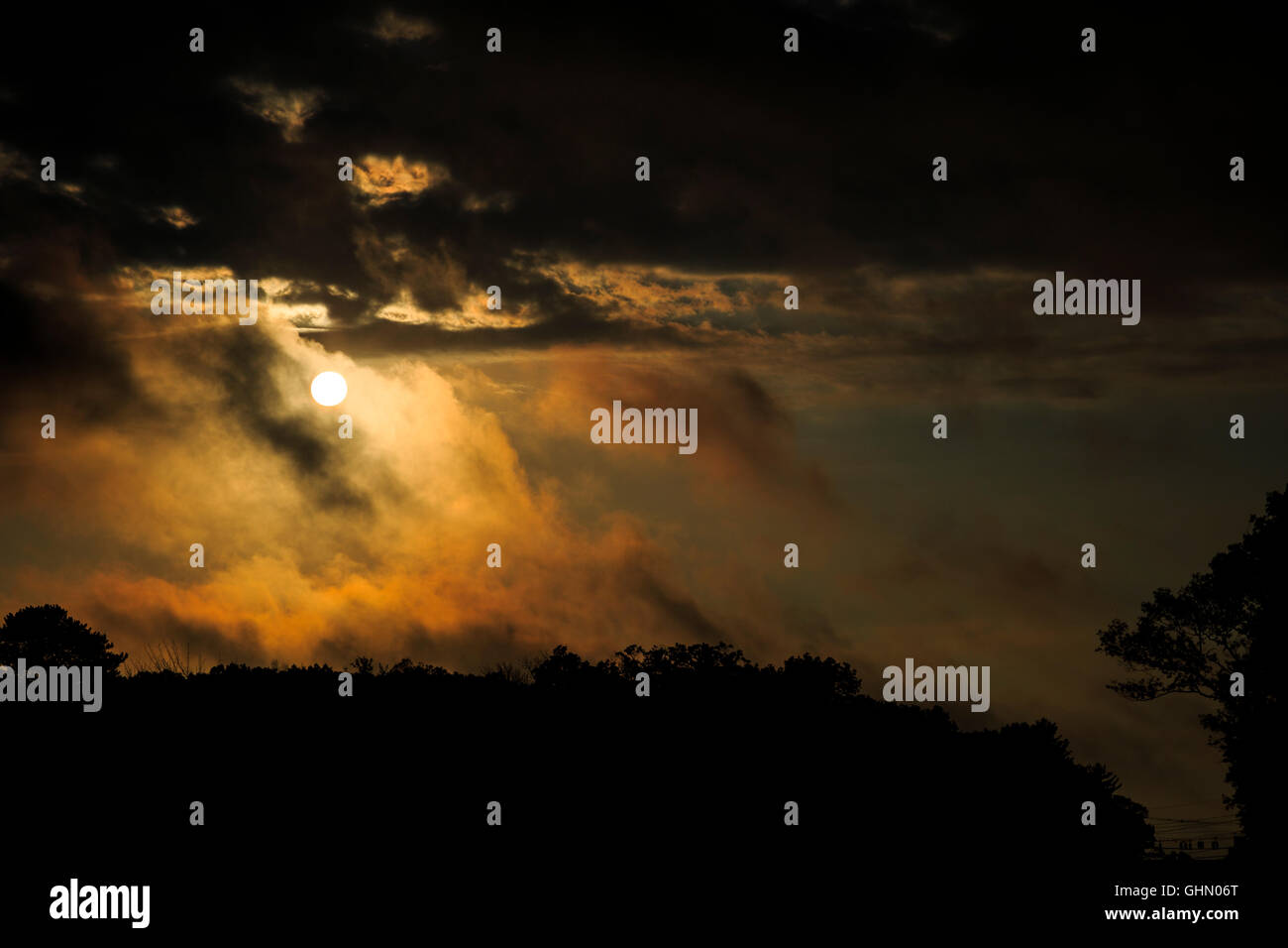 Sun Behind Clouds Stock Photo - Alamy