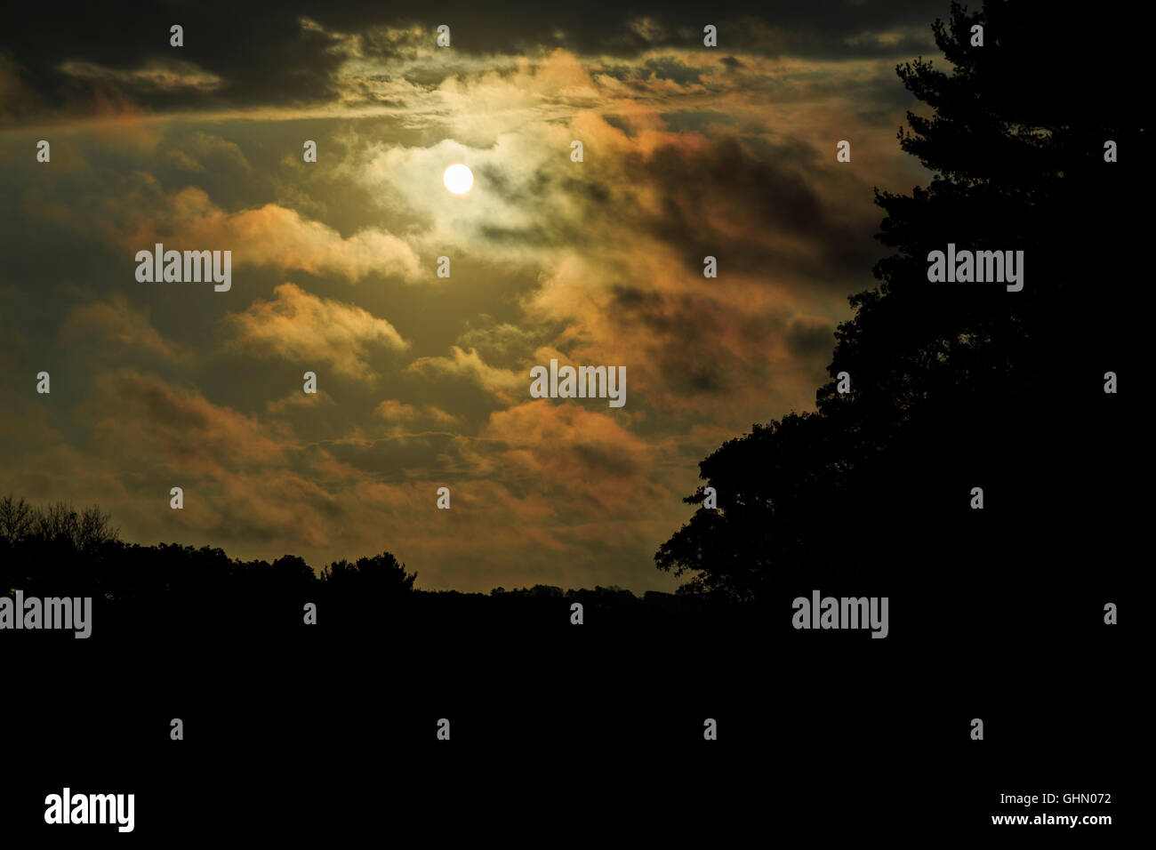 Sun Behind Clouds Stock Photo - Alamy