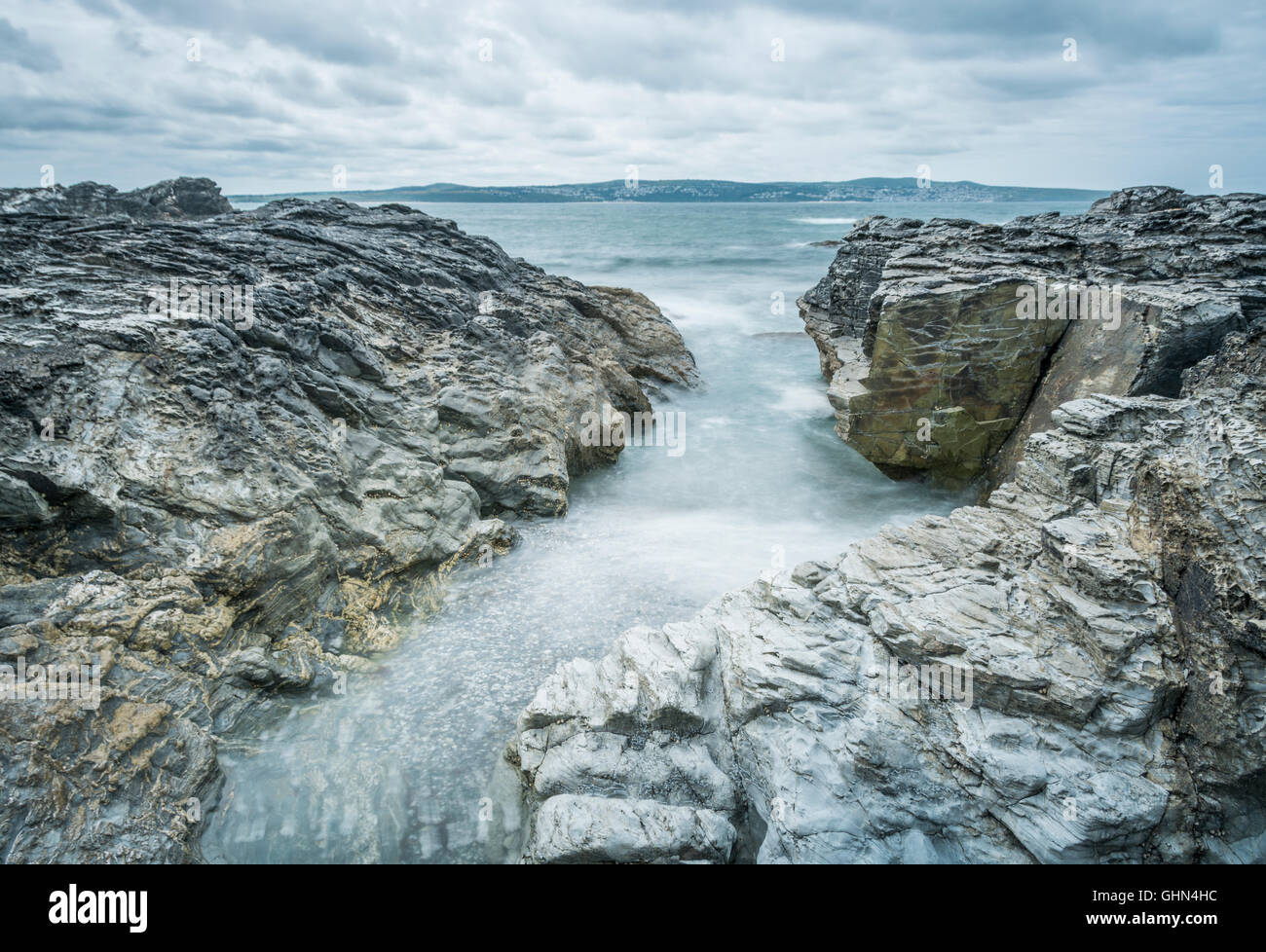 Long exposure of the rising tide on the rocks at Godrevy in North ...